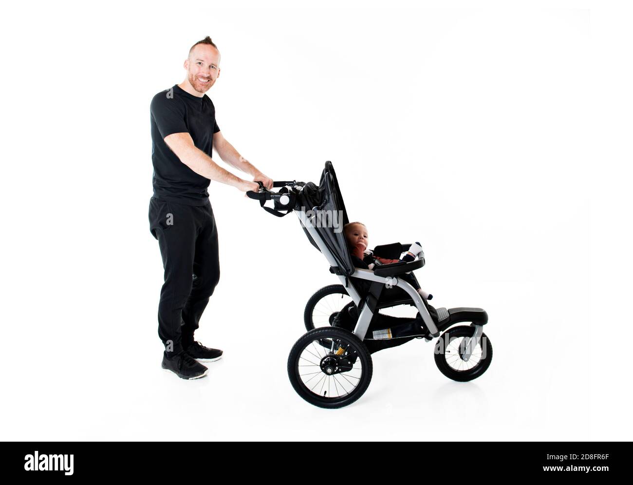 A father jogging with a baby stroller Stock Photo - Alamy