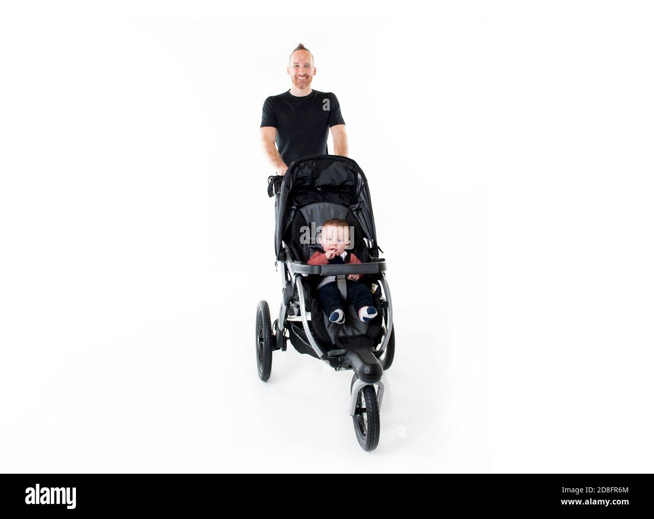 A father jogging with a baby stroller Stock Photo - Alamy