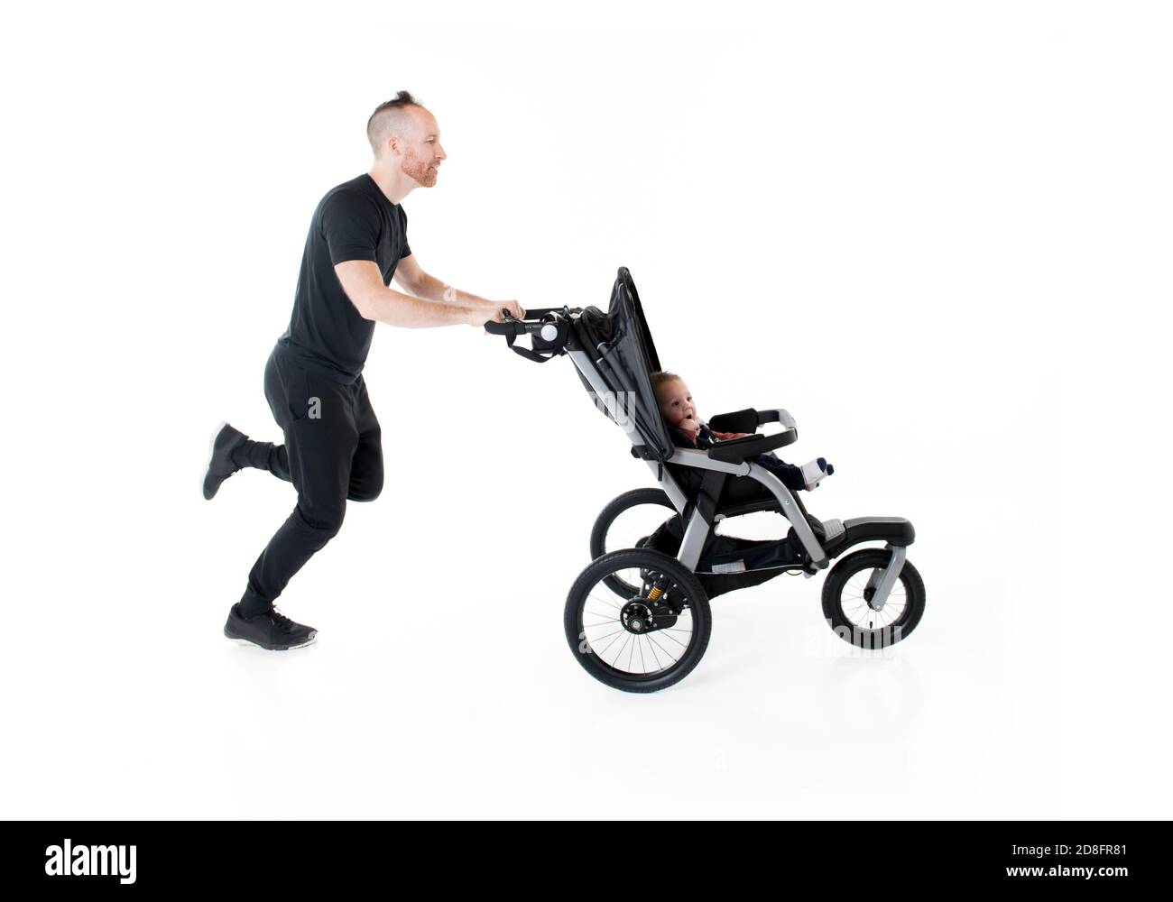 A father jogging with a baby stroller Stock Photo - Alamy