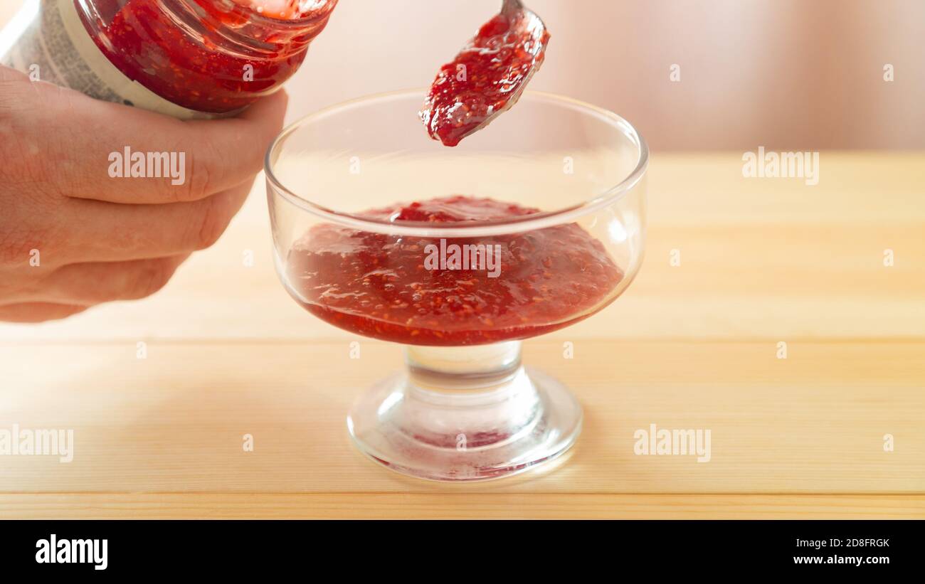 Raspberry jam is placed in a glass dish Stock Photo - Alamy