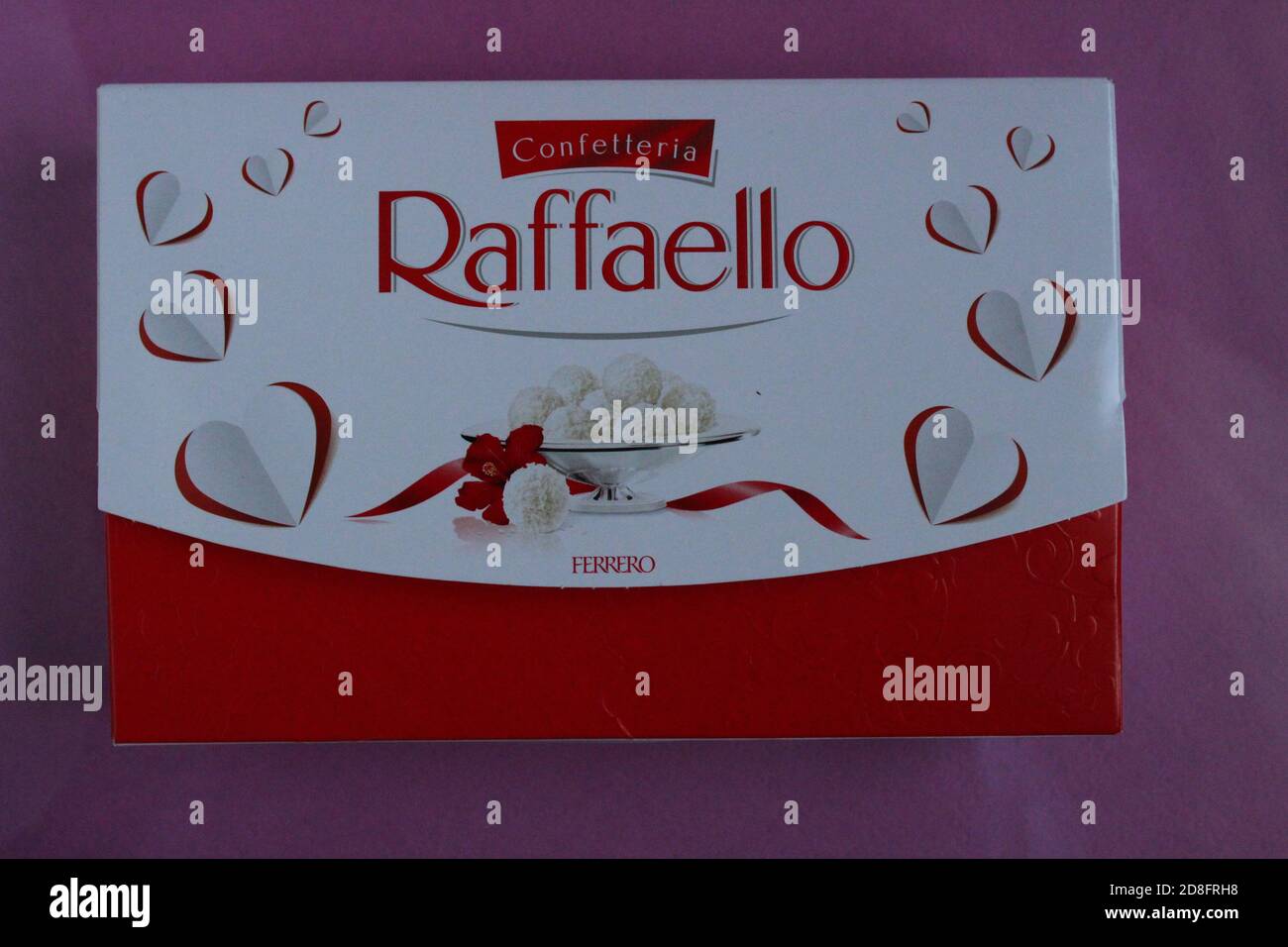 white candies round and halves in the background is a square ...