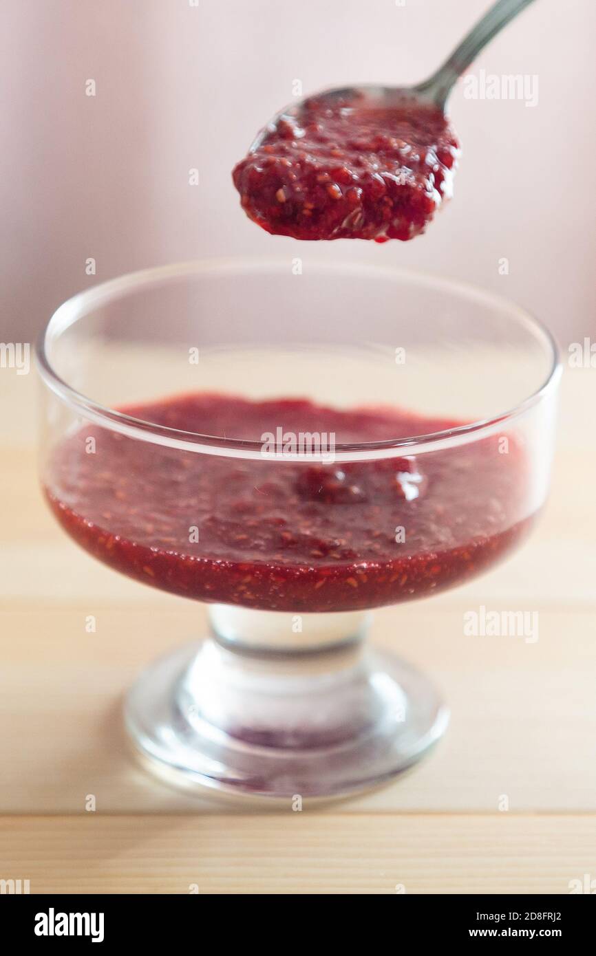 Raspberry jam is placed in glass dish Stock Photo - Alamy