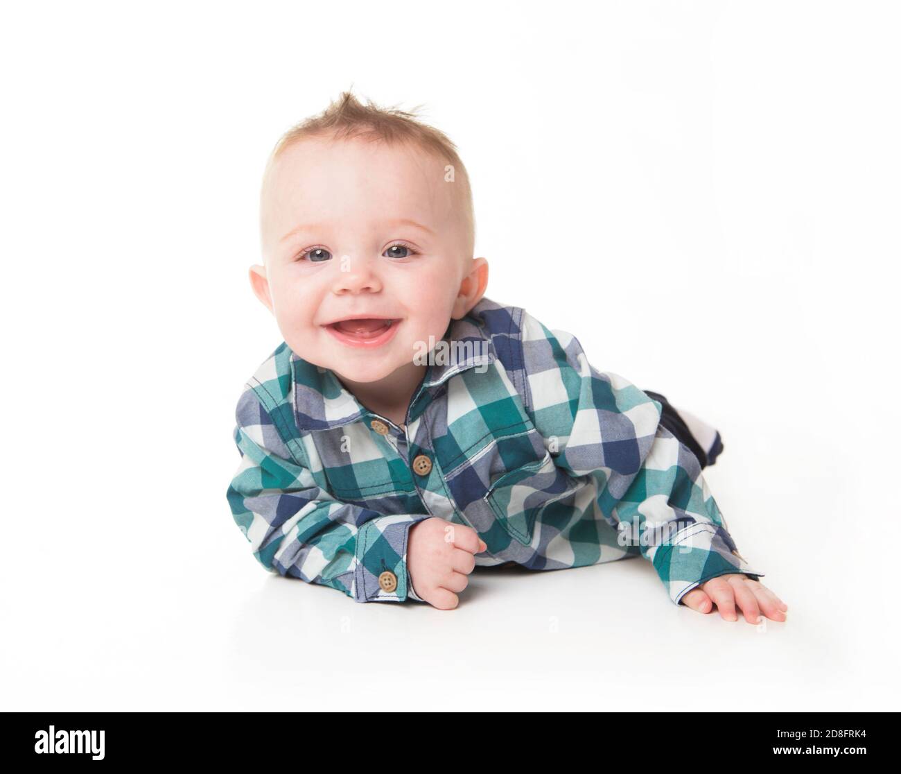 Baby boy sitting on the floor, calm and relaxed Stock Photo - Alamy