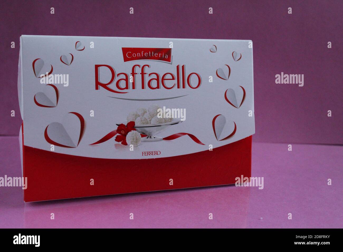 white candies round and halves in the background is a square ...