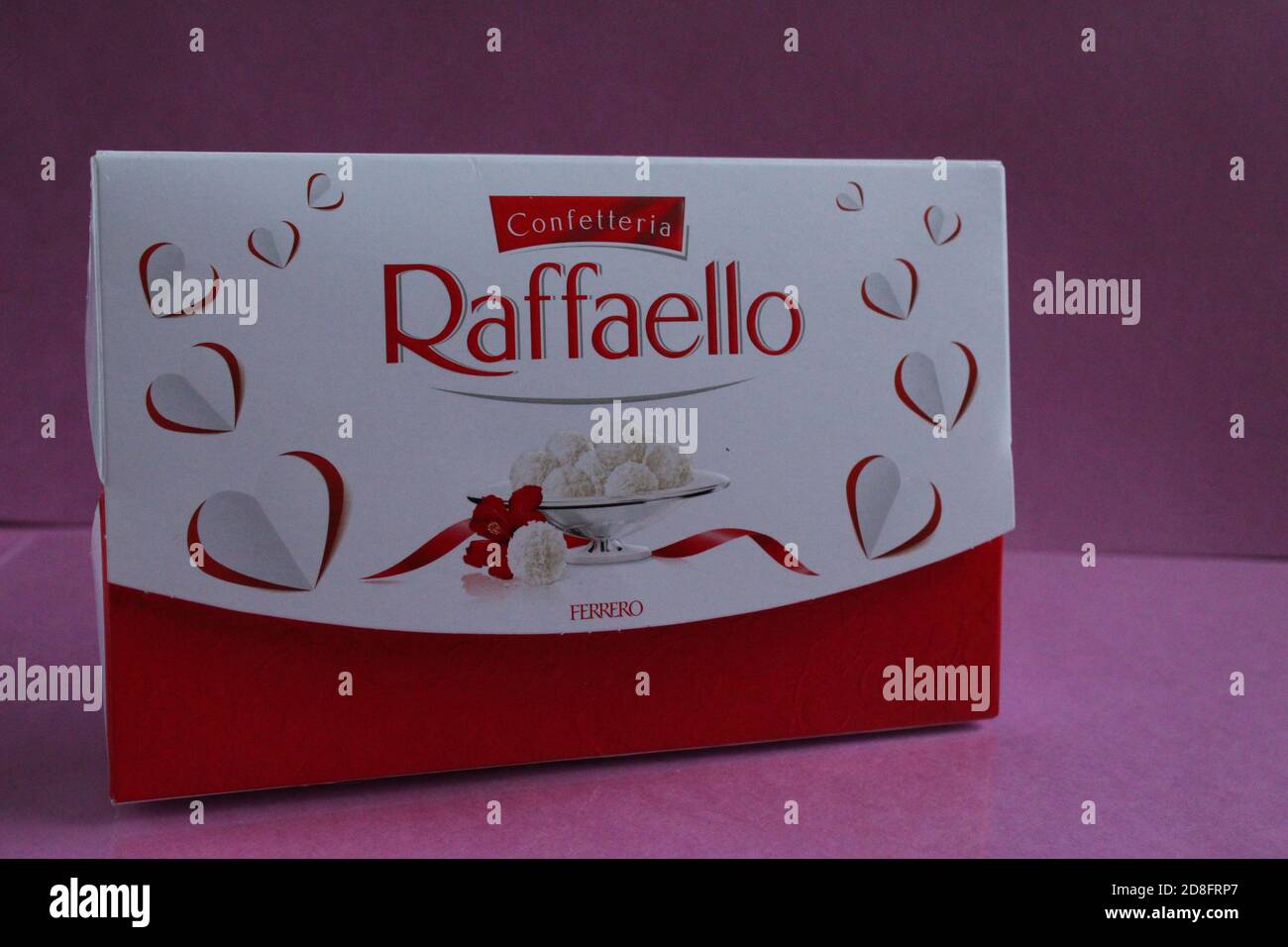 white candies round and halves in the background is a square ...