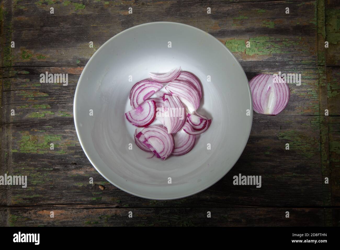 Cut Onions Setup on White Plate With Half Cut Onion as Decoration Stock ...