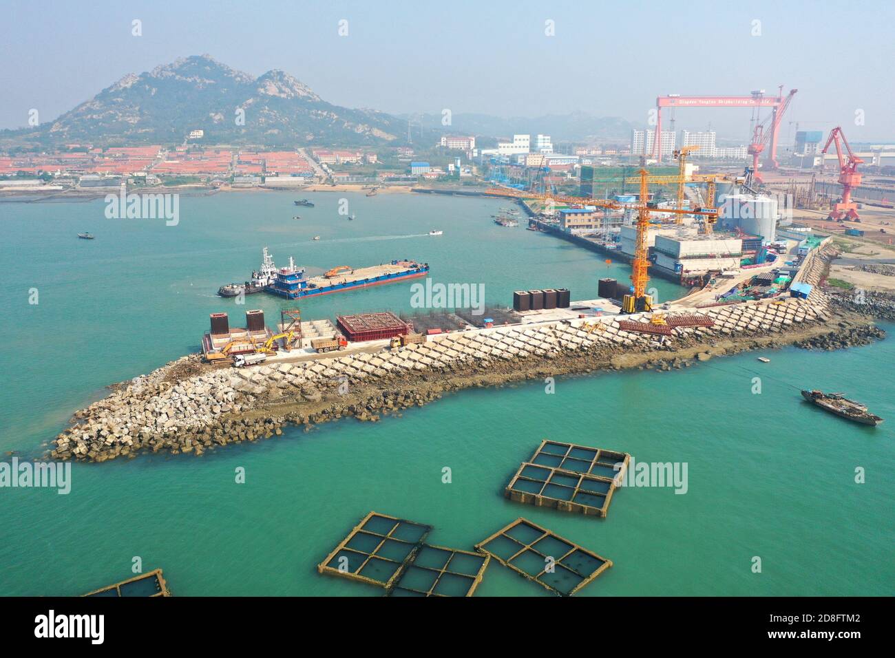 Aerial view of Qingdao Port undergoing expansion in Qingdao city, east ...