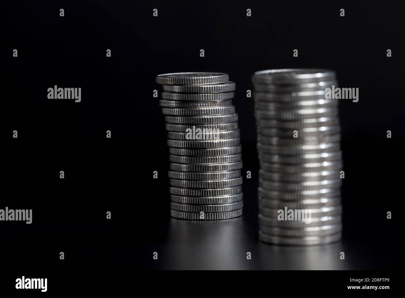 steel identical coins Stock Photo - Alamy
