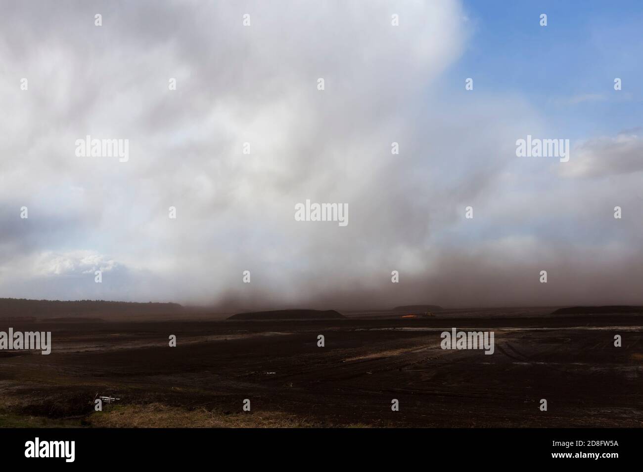 dust from peat excavations flying against the sky Stock Photo - Alamy