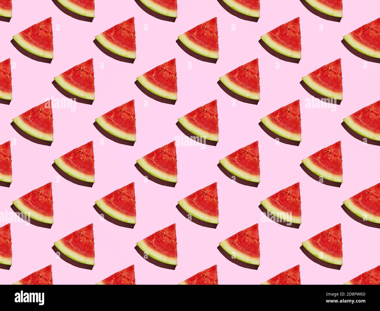 Slice of Mini Watermelon pattern on a pink background with a hard ...