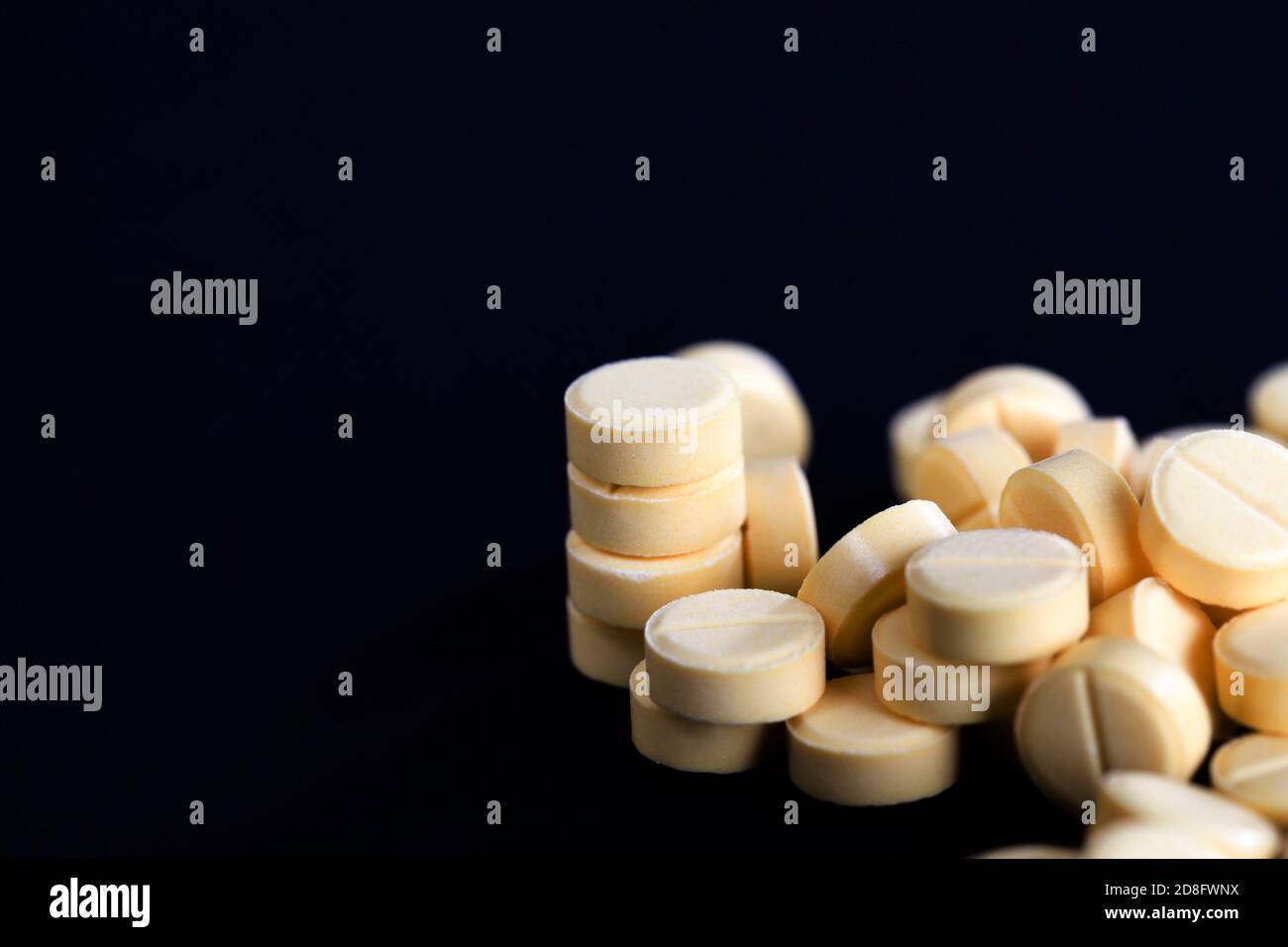 yellow tablets for flu diseases Stock Photo - Alamy