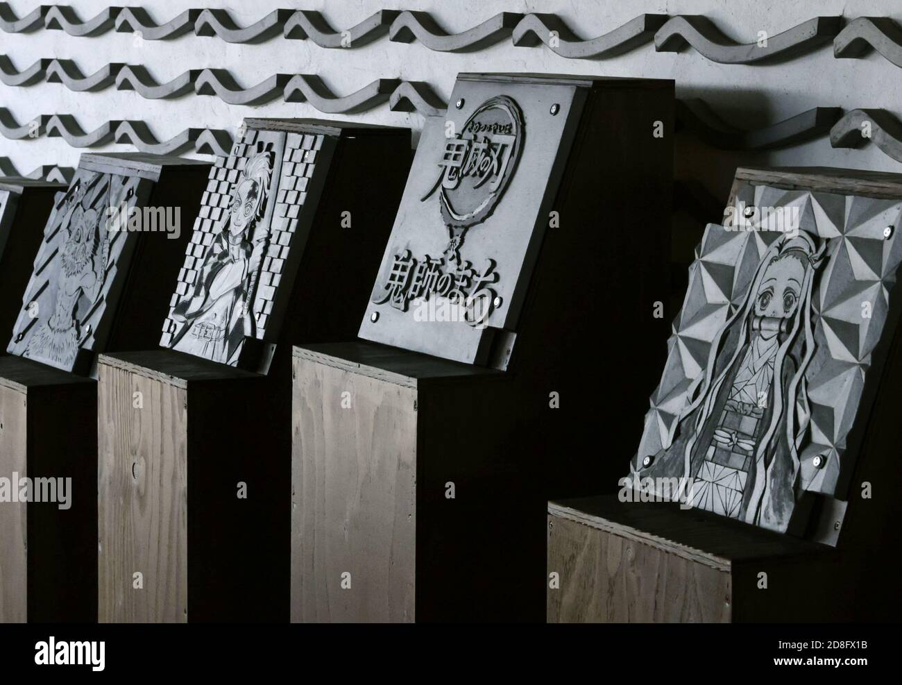 A set of monuments featuring "kawara" roof tiles with characters from ...