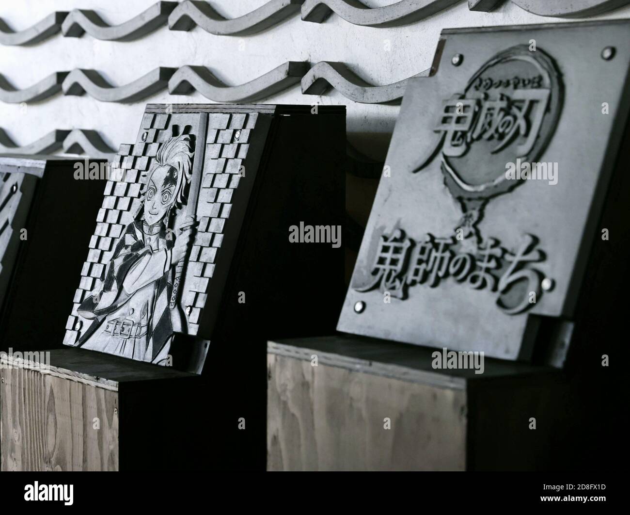 A set of monuments featuring "kawara" roof tiles with characters from ...