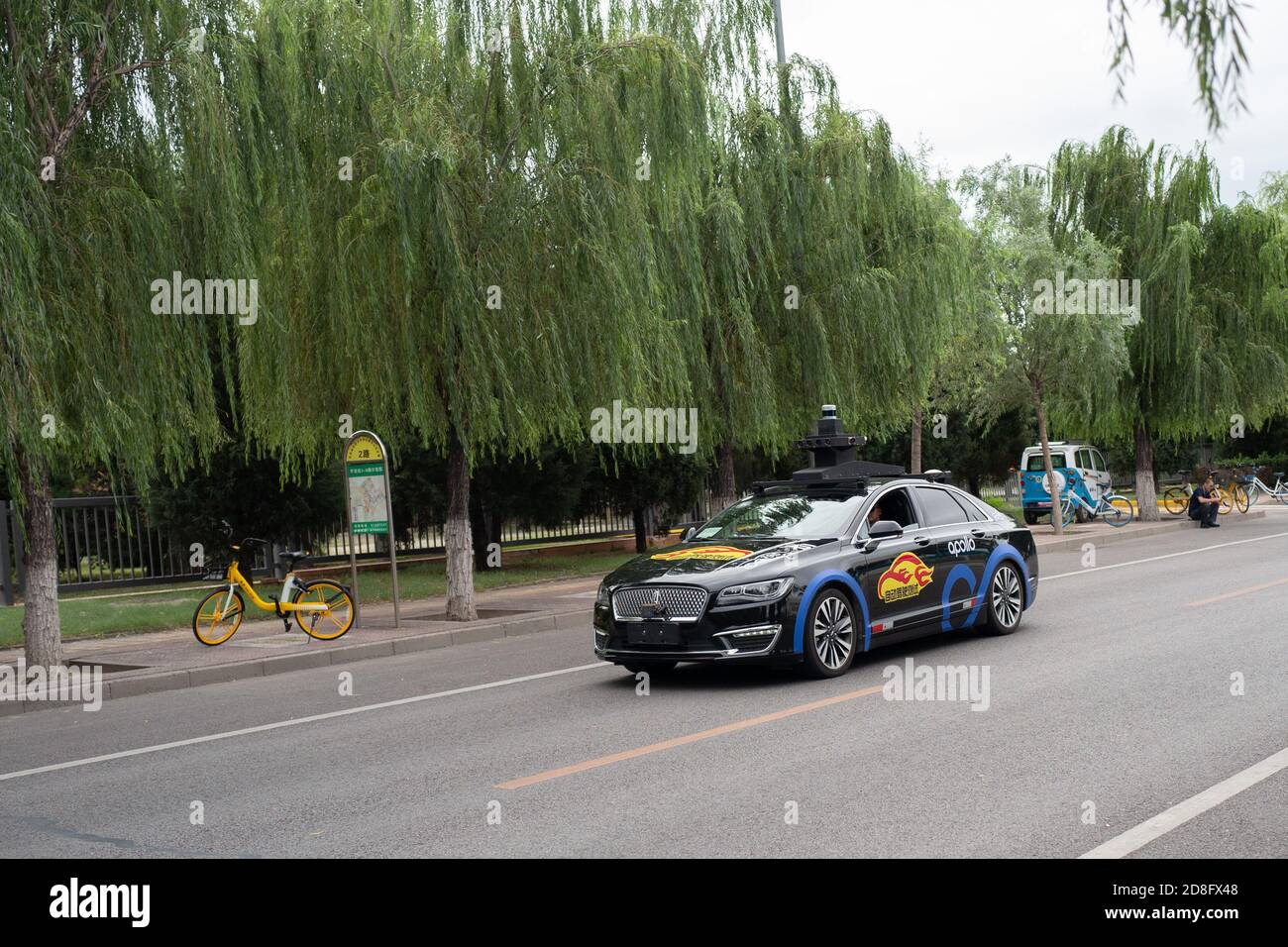 An Apollo Go Robotaxi drives on a road in Beijing, China, 10 September ...