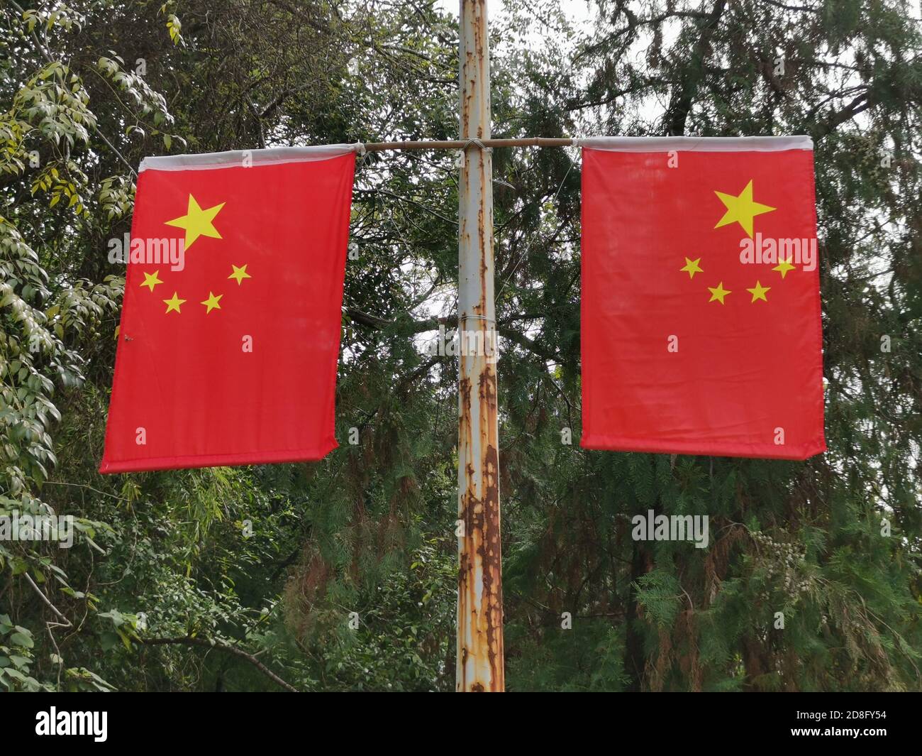 Red lanterns and national flags are seen flying along the Yihe street ...