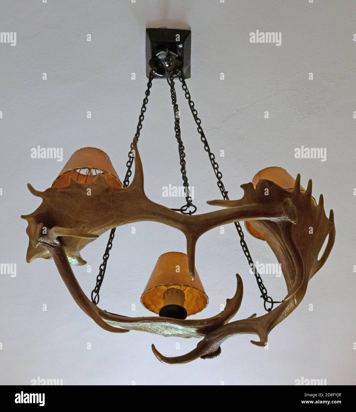 Very old antler chandelier, hanging on the ceiling Stock Photo - Alamy