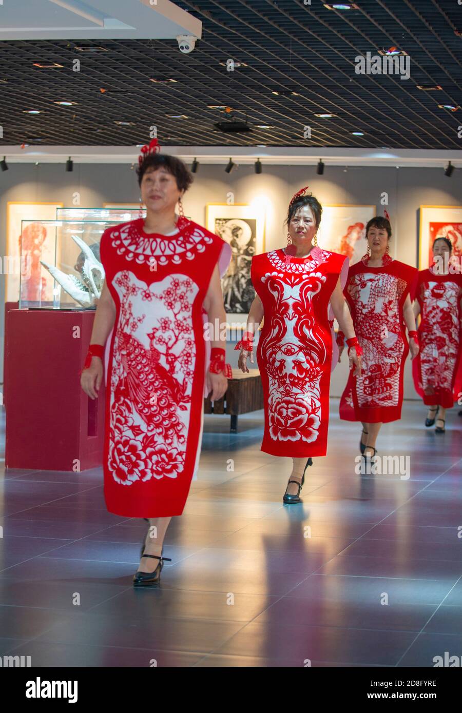 Elder models present papercut qipao or Chinese long gown at Shenyang ...