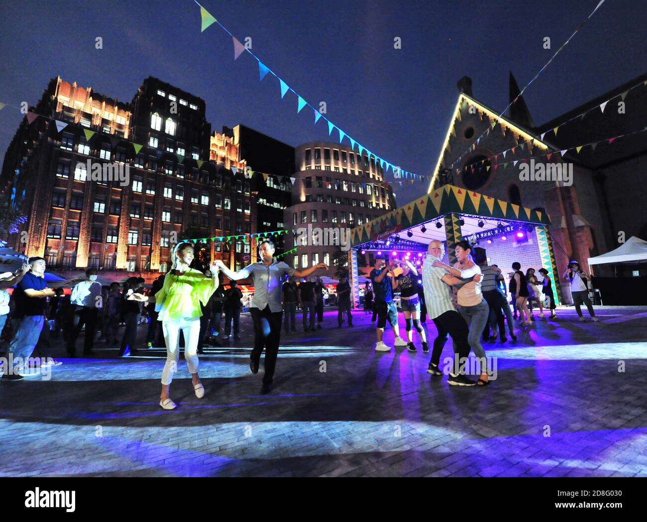 Tourists enjoy the Latin-America-themed night market by not only ...