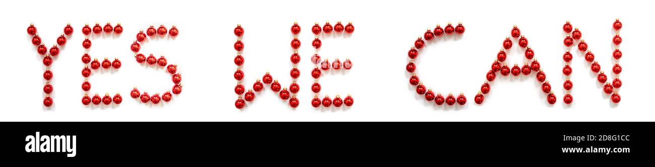 Red Christmas Ball Ornament Building Word Yes We Can Stock Photo - Alamy