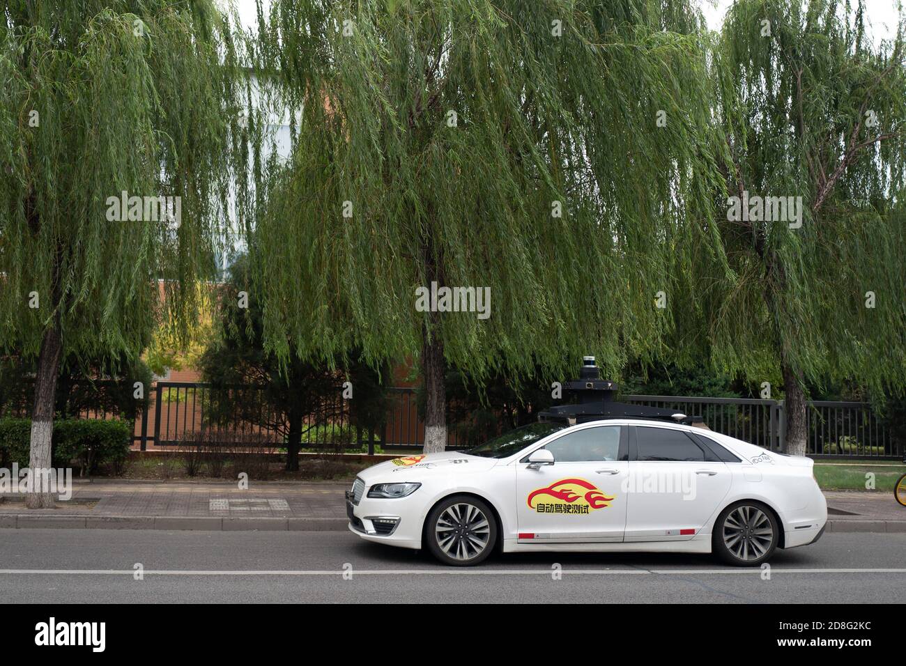 An Apollo Go Robotaxi drives on a road in Beijing, China, 10 September ...