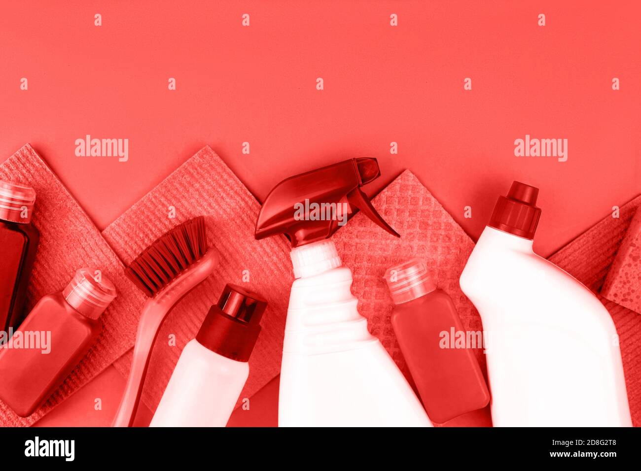 House cleaning products are on red background Stock Photo - Alamy