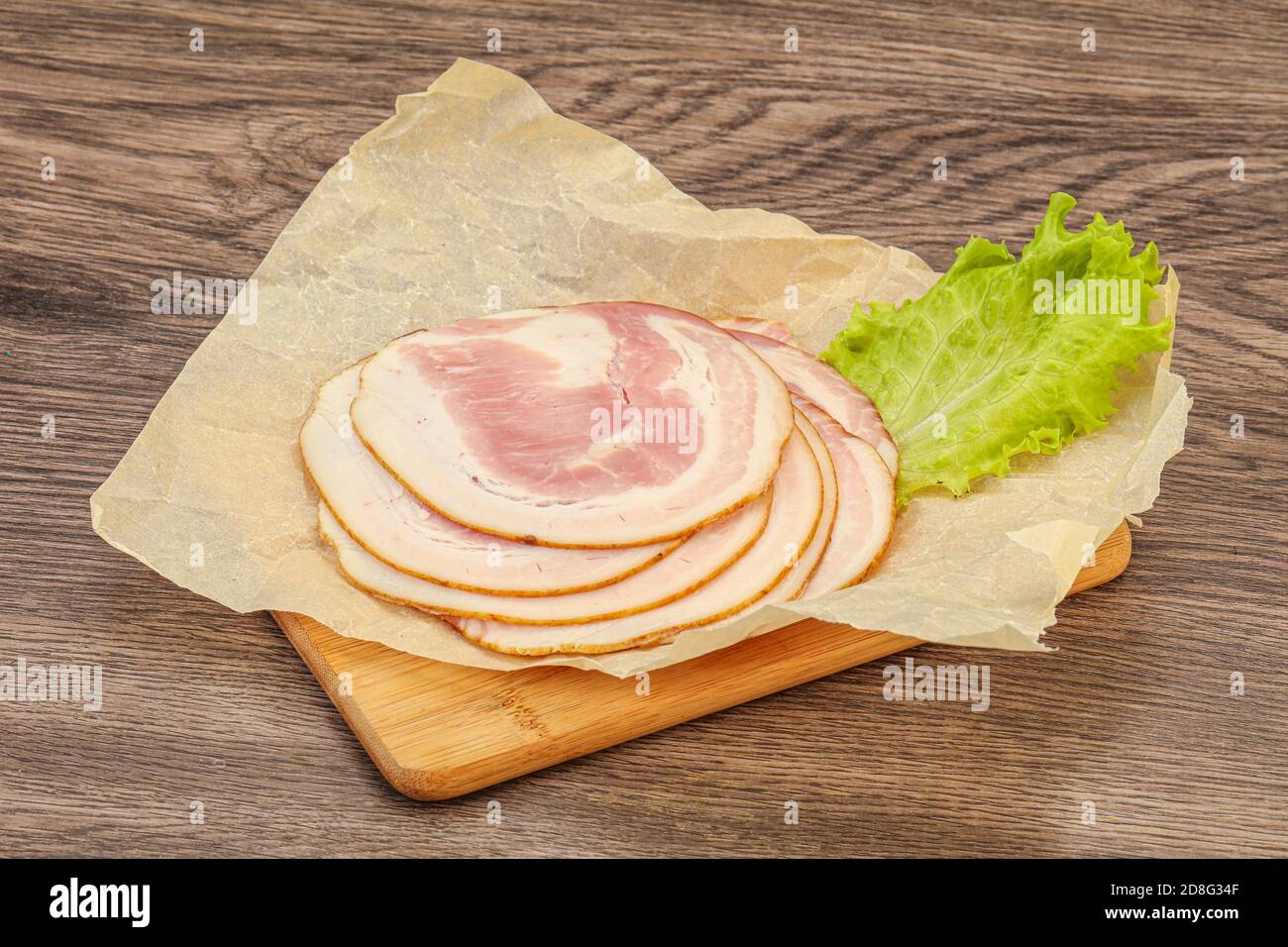 Sliced Italian Pancetta sausage over board Stock Photo - Alamy