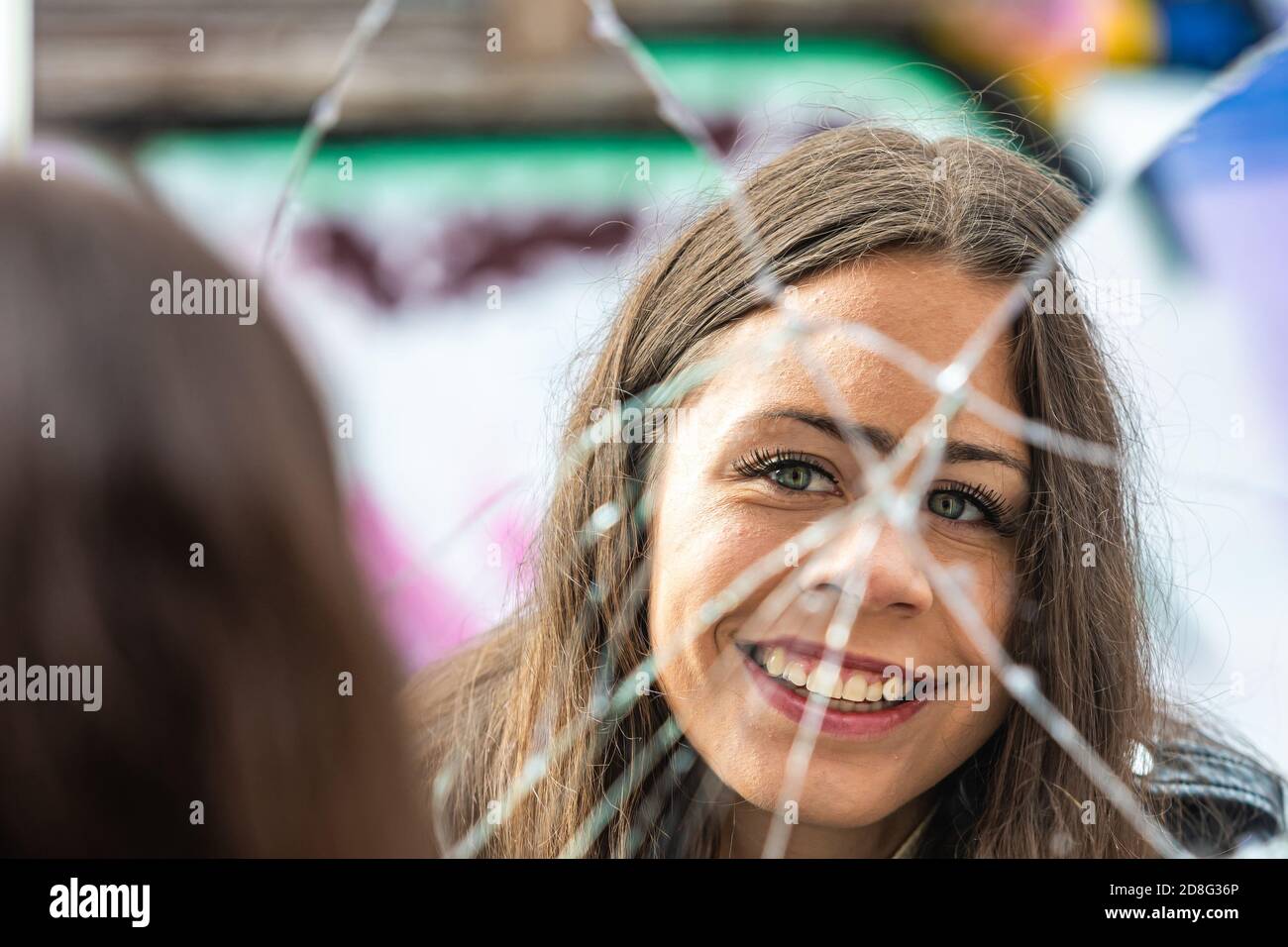 Girl looking in a broken mirror hi-res stock photography and images - Alamy