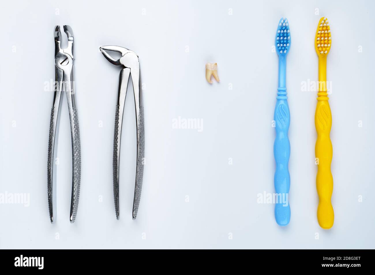Dental tools with tooth on isolated white background Stock Photo - Alamy