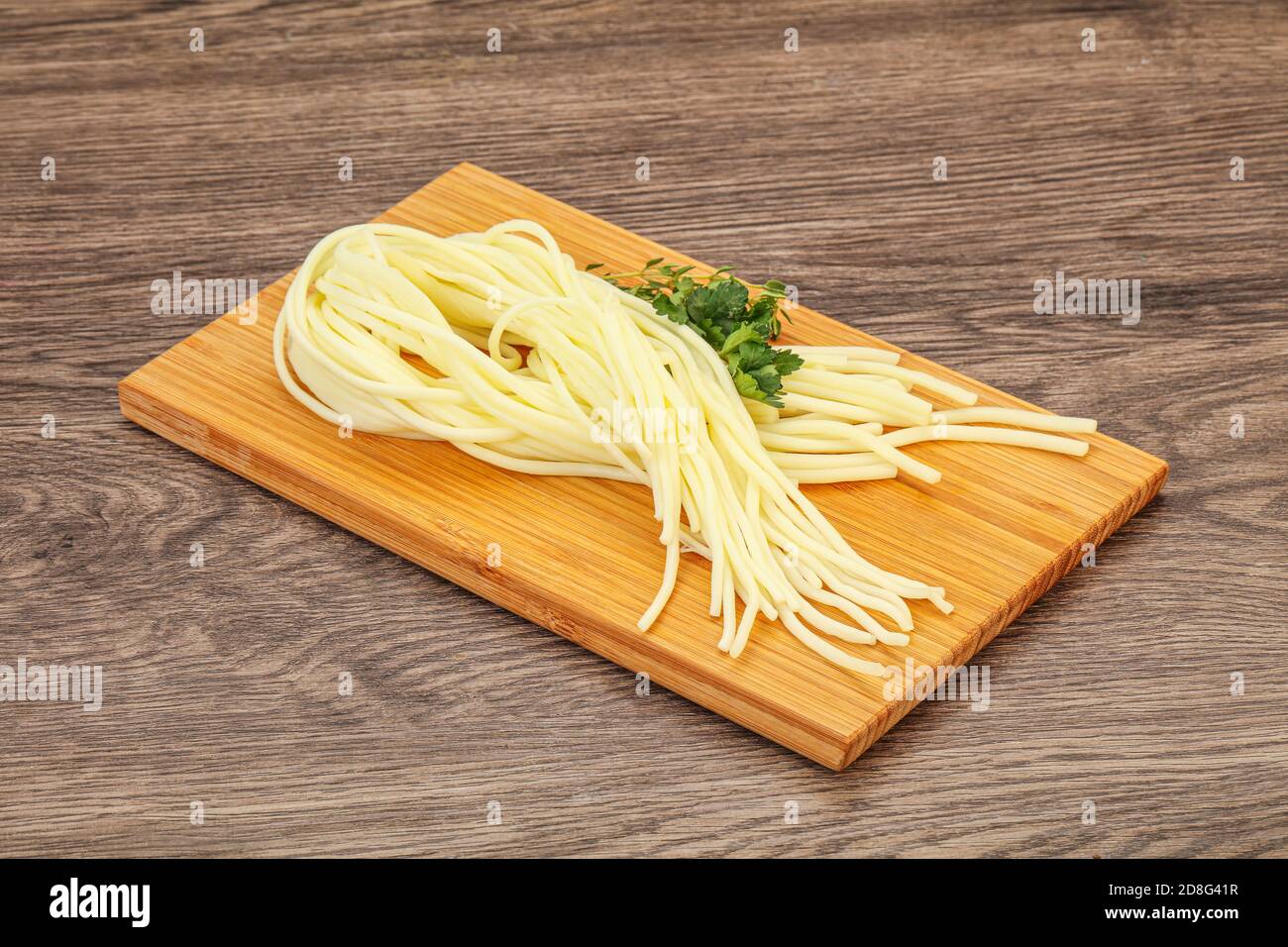 Chechil spaghetti cheese snack over board Stock Photo - Alamy