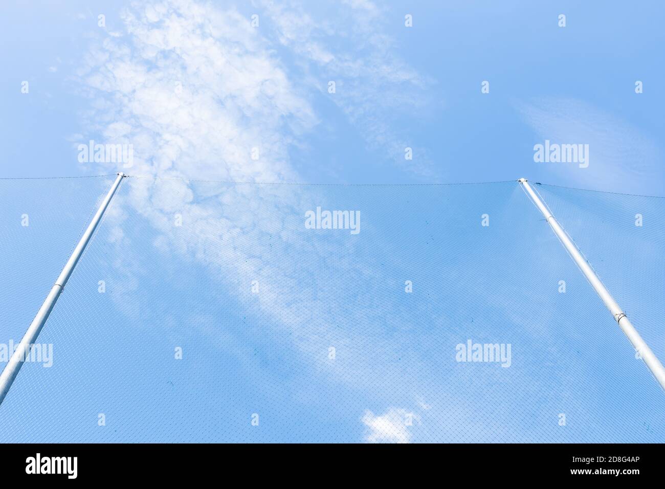 net mesh grid and blue sky background Stock Photo - Alamy