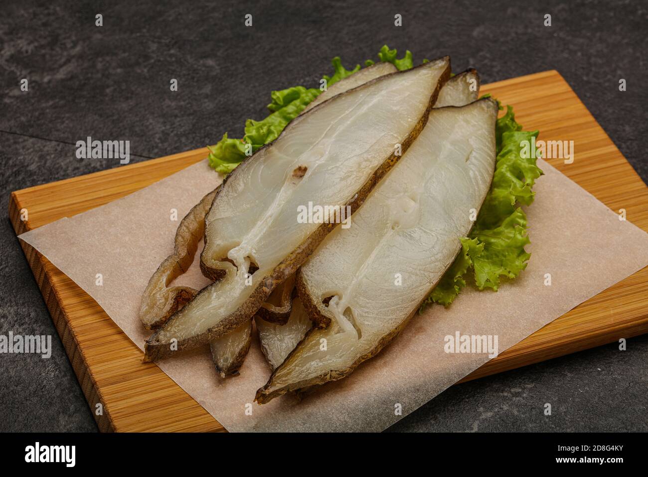 Delicous smoked halibut fish slices snack Stock Photo - Alamy