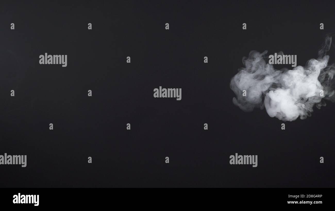 Shooting of cigarette cloudy smoke on black background Stock Photo - Alamy