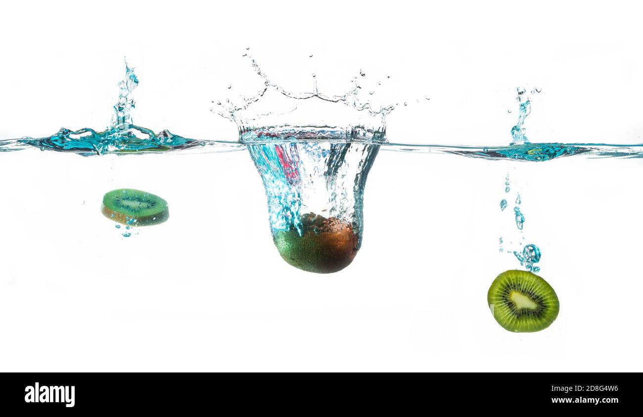 fresh kiwi splash in water on white background Stock Photo - Alamy