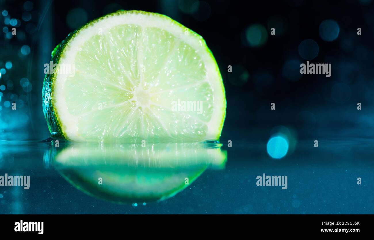 fresh lime splash in water on white background Stock Photo - Alamy