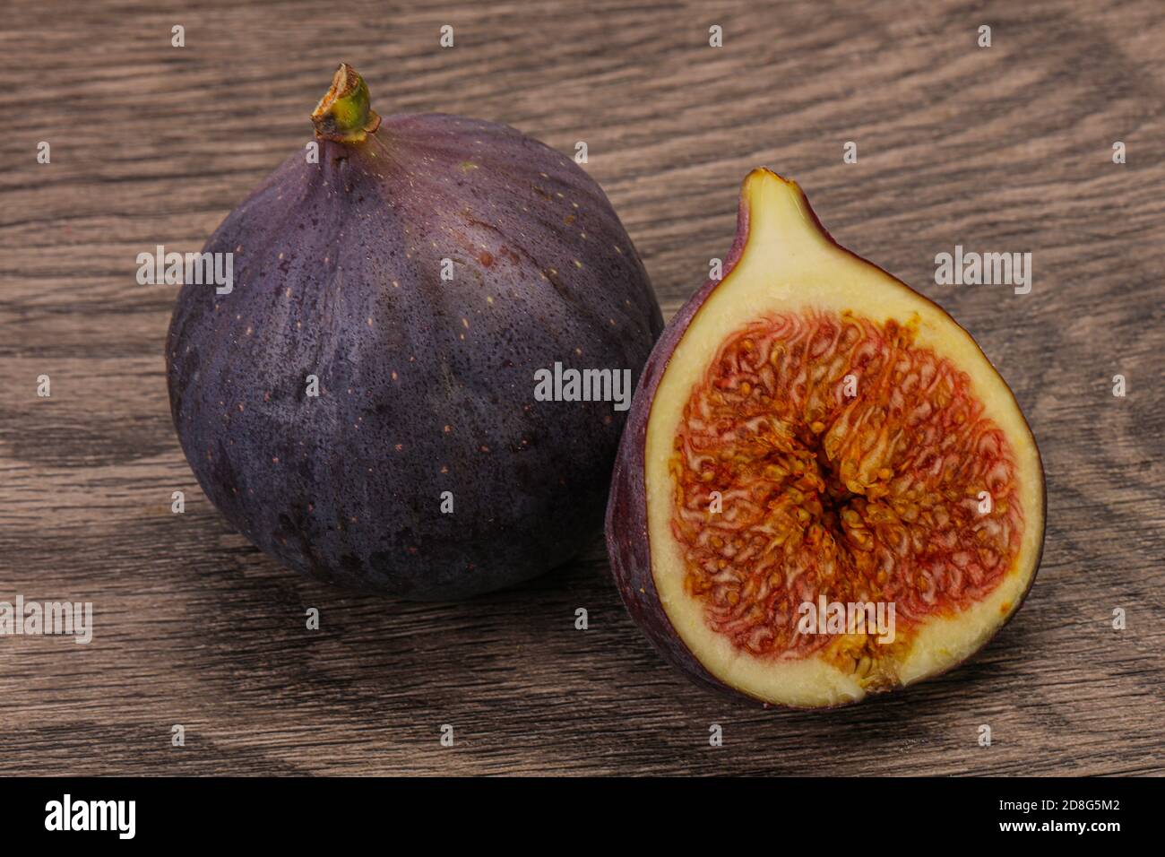 Sweet purple slice of fig fruit Stock Photo - Alamy