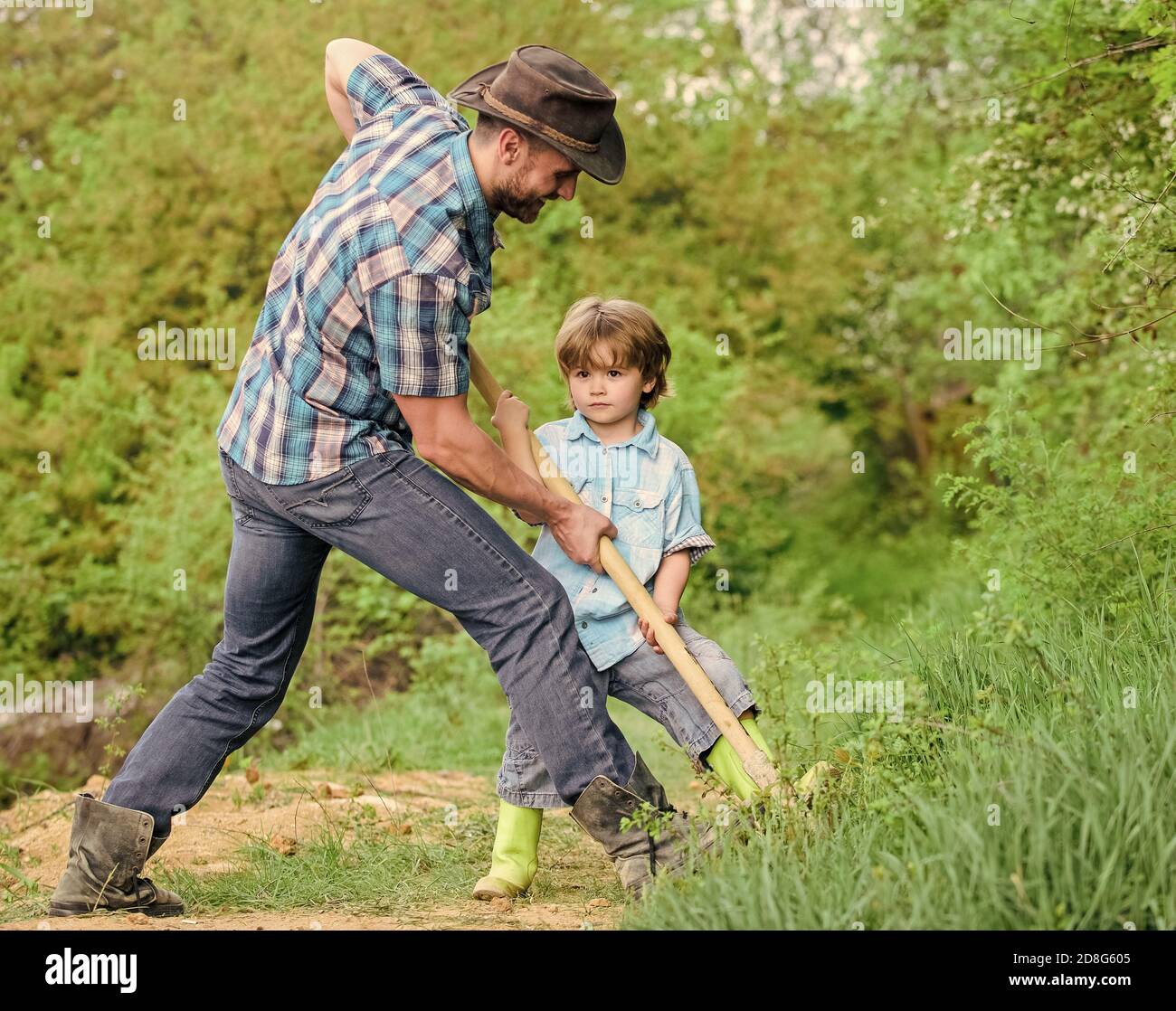Find treasures. Little boy and father with shovel looking for treasures ...