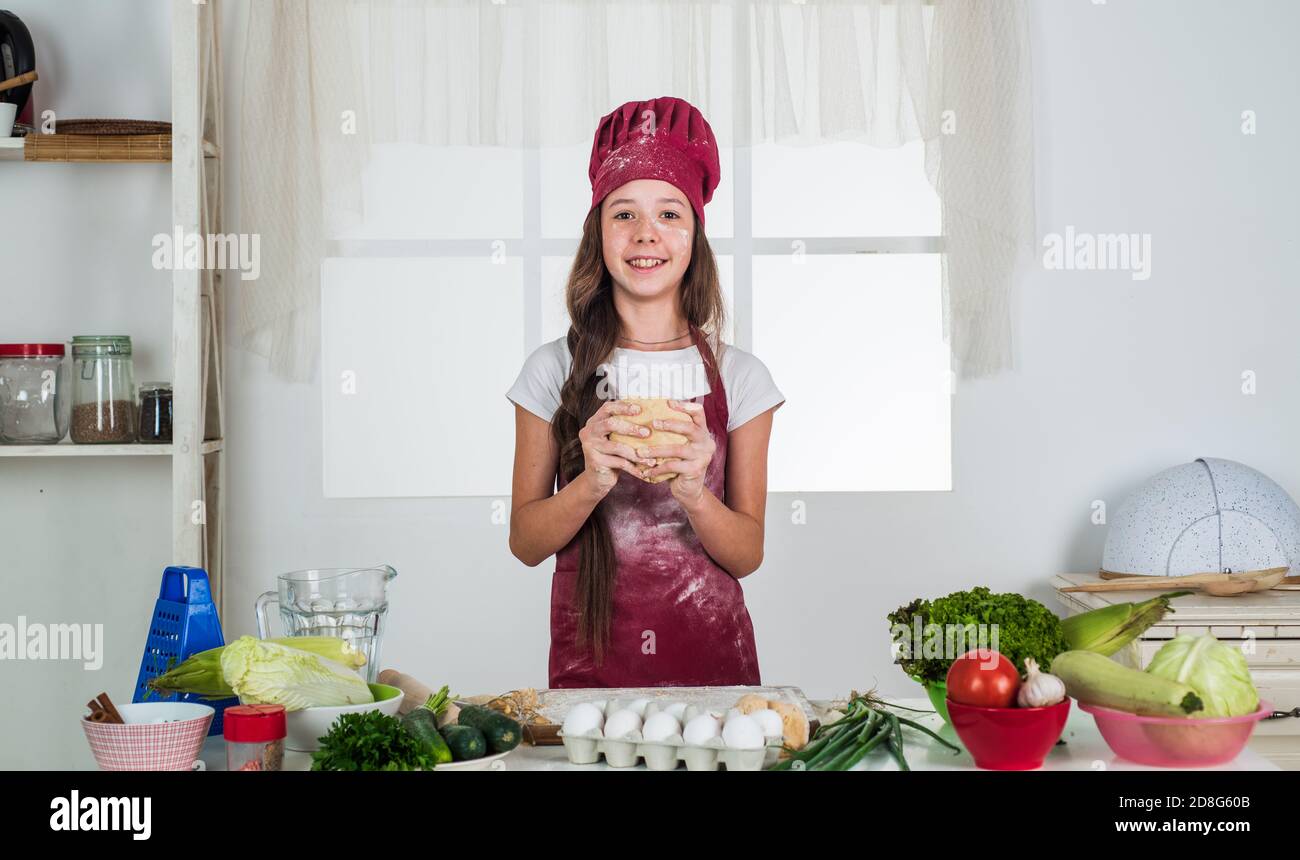 small girl baking in kitchen. kid chef cooking making dough. child ...