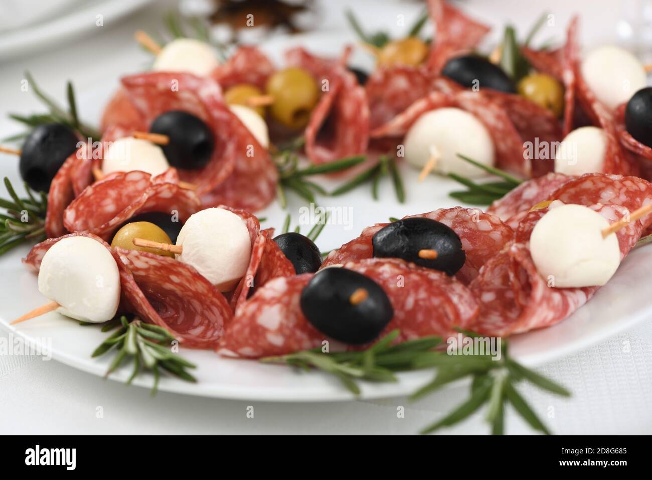 Christmas wreath - antipasto. Salami canapes with olives, baby ...