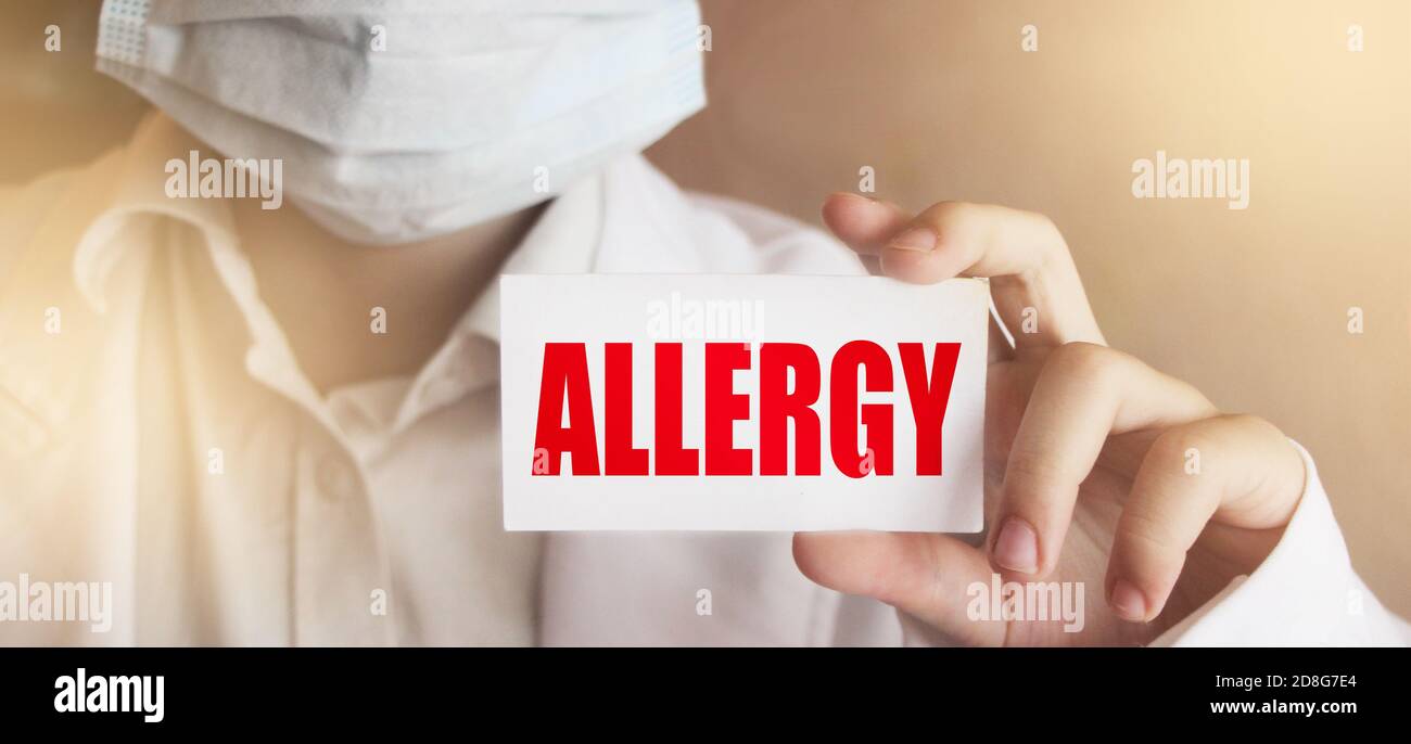 Allergy word on medical card in Doctor's hand. Medicine healthcare ...