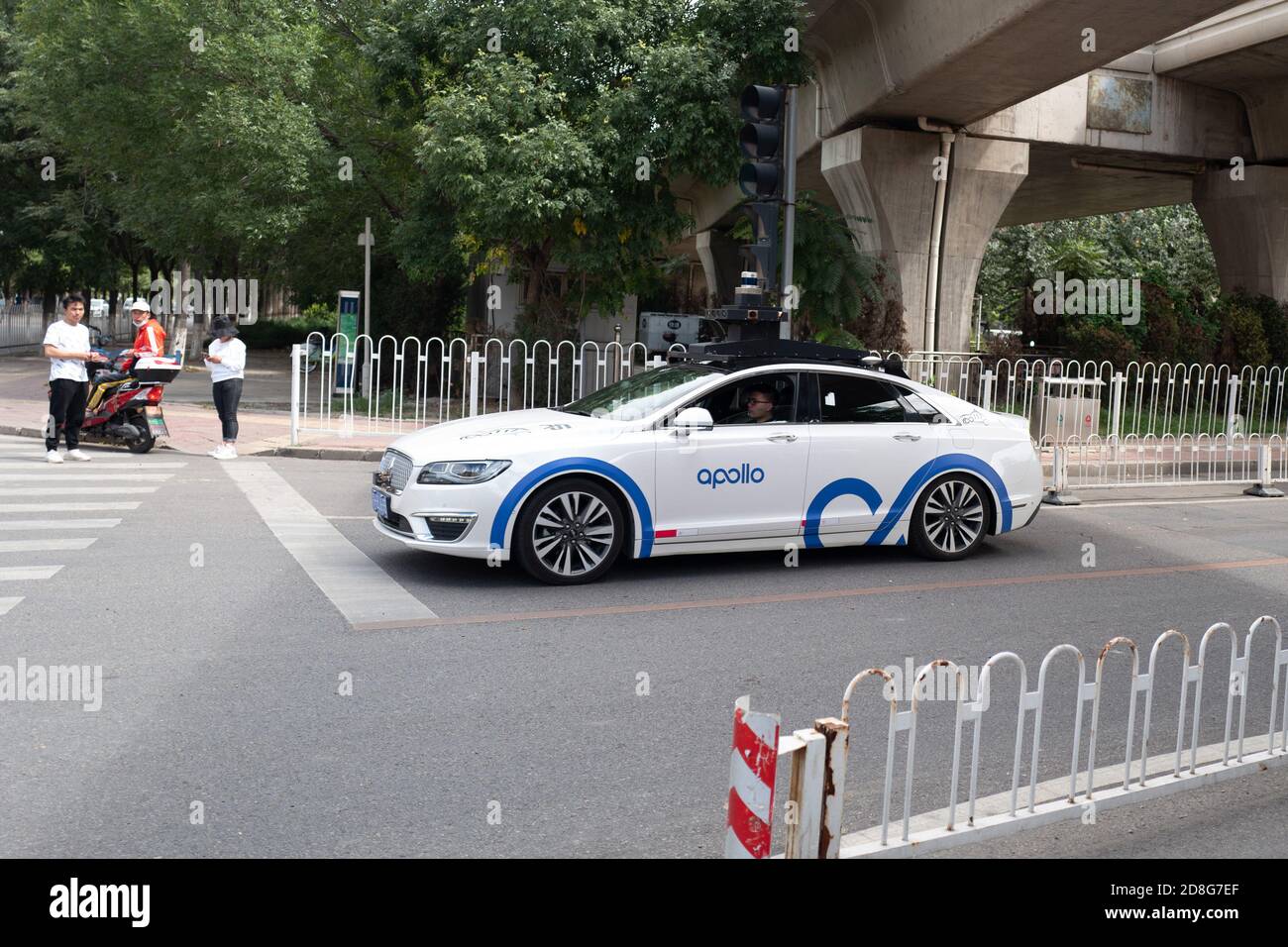 An Apollo Go Robotaxi drives on a road in Beijing, China, 10 September ...