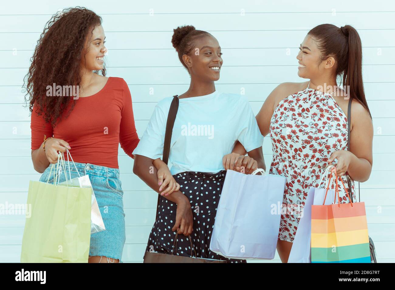 Happy group of friends shopping in spring and summer season. A picture ...