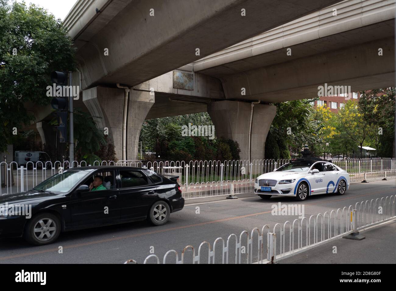 An Apollo Go Robotaxi drives on a road in Beijing, China, 10 September ...