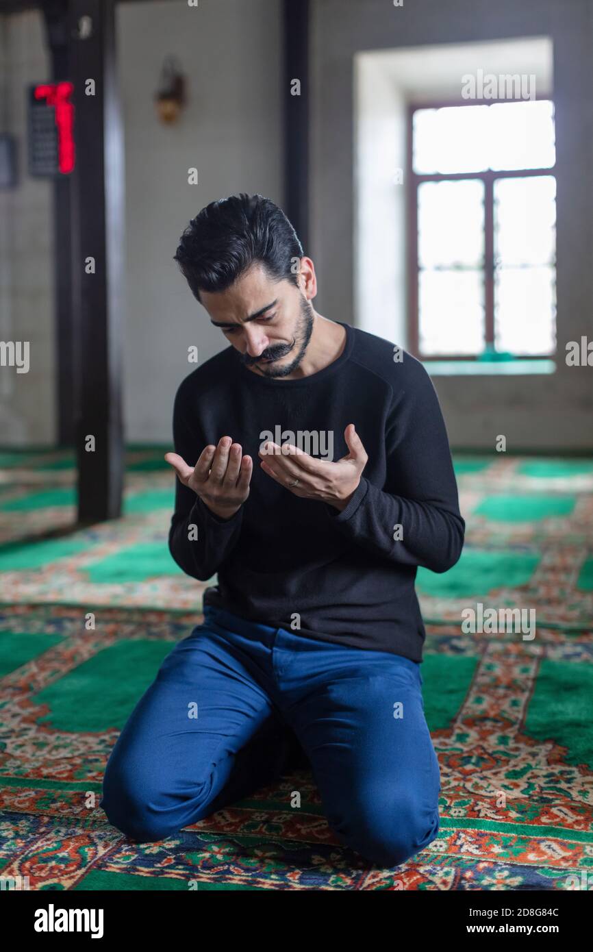 Young Mustached Man Praying In Mosque Stock Photo - Alamy