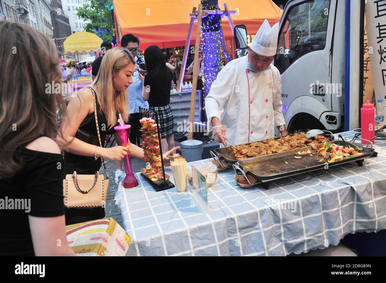 Tourists enjoy the Latin-America-themed night market by not only ...
