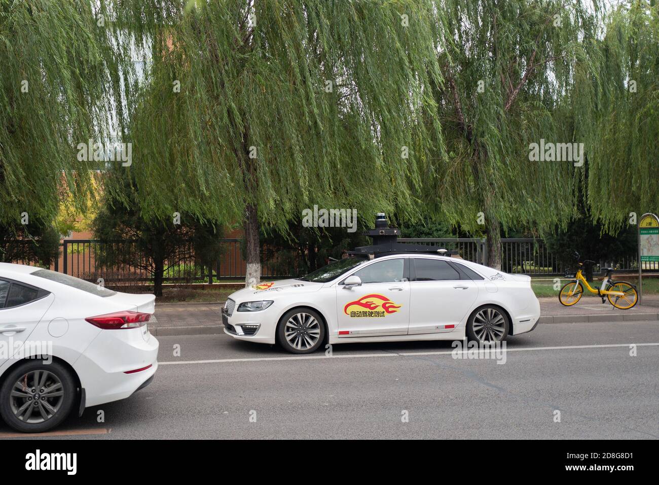 An Apollo Go Robotaxi drives on a road in Beijing, China, 10 September ...