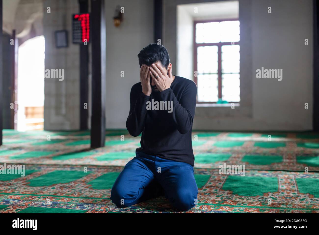 Young Mustached Man Praying In Mosque Stock Photo - Alamy