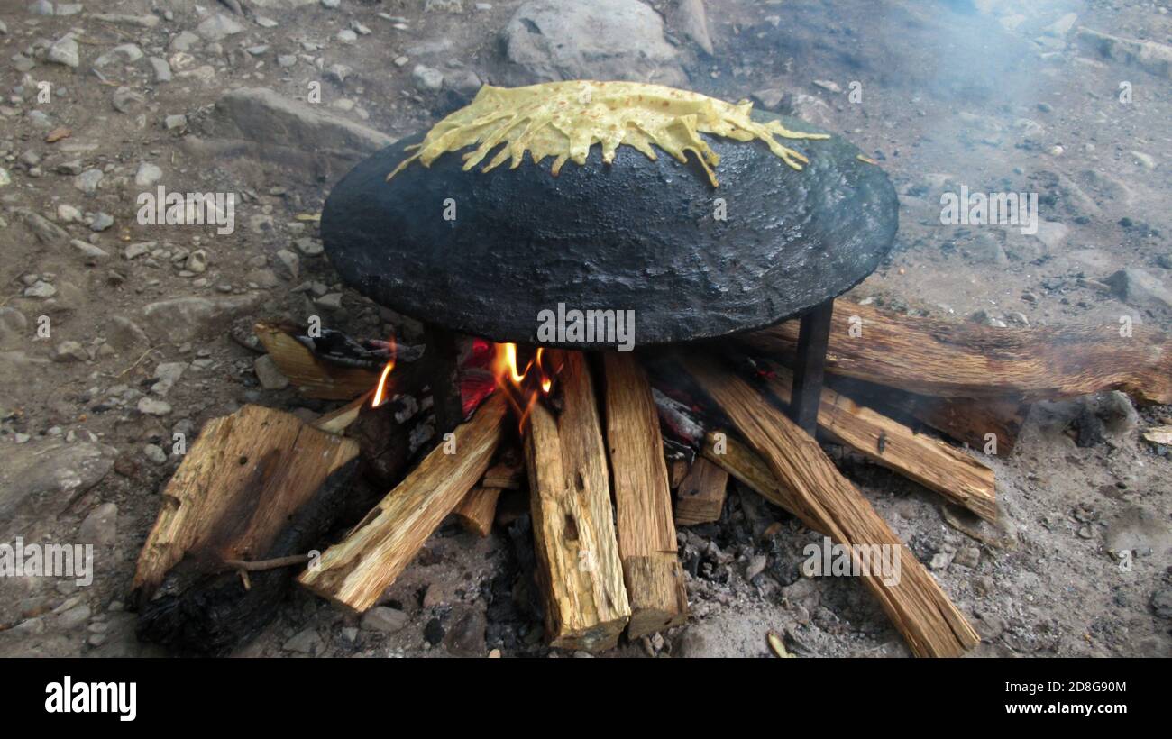 Azerbaijani Makhara cooked on a saj in a rural village. Sweet slim ...