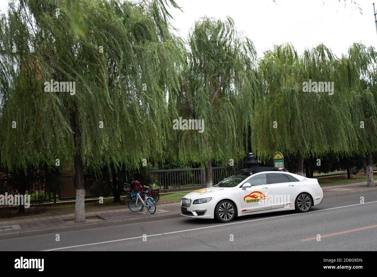 An Apollo Go Robotaxi drives on a road in Beijing, China, 10 September ...
