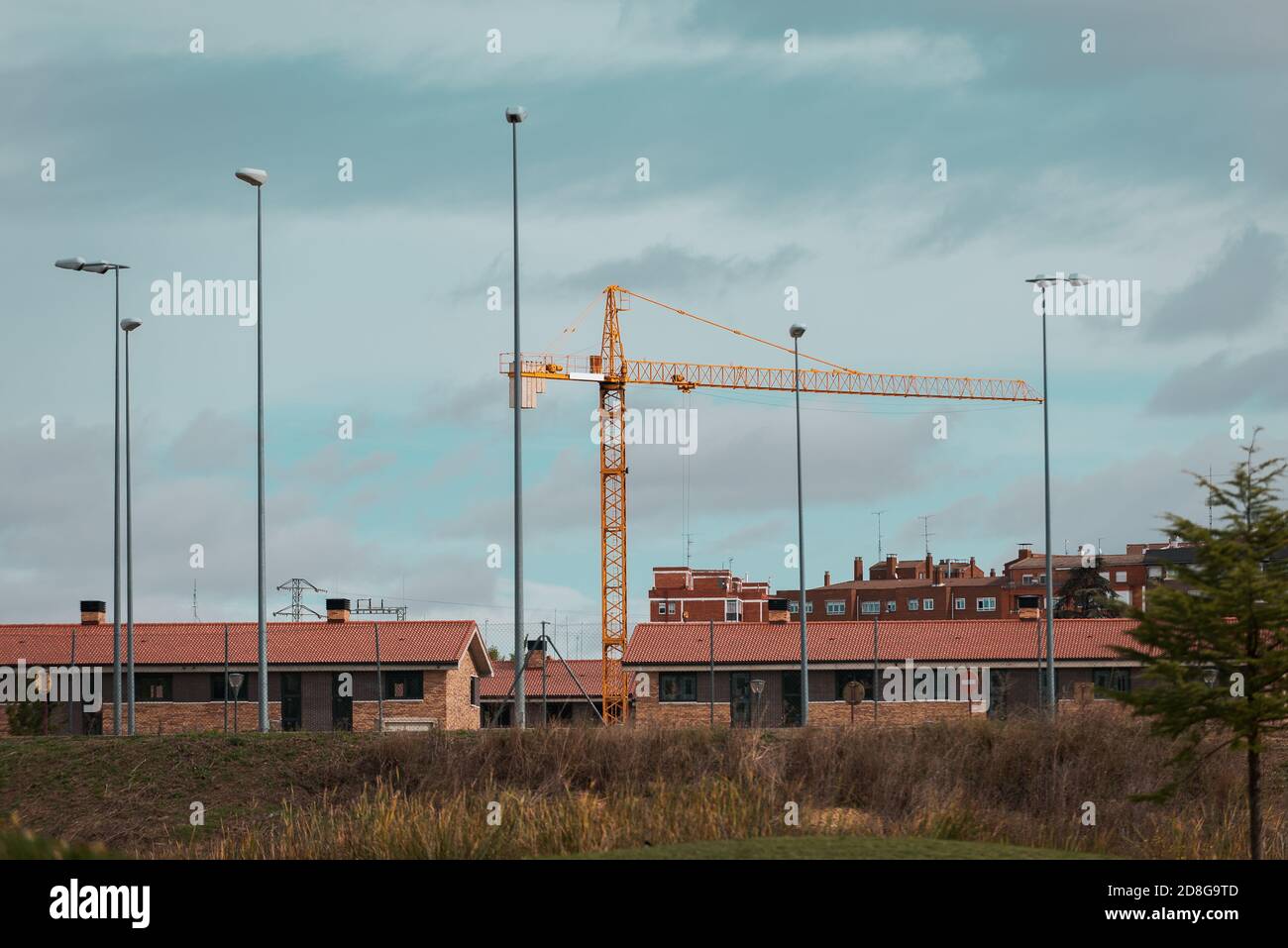 crane, utility poles and the housing boom in small towns. Palencia ...