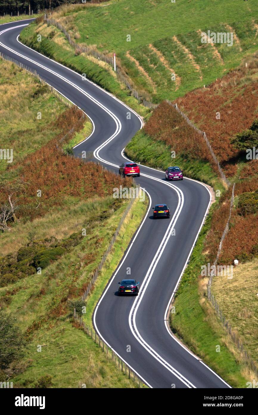 Cars traveling on a winding country road (A487} in Snowdonia National ...